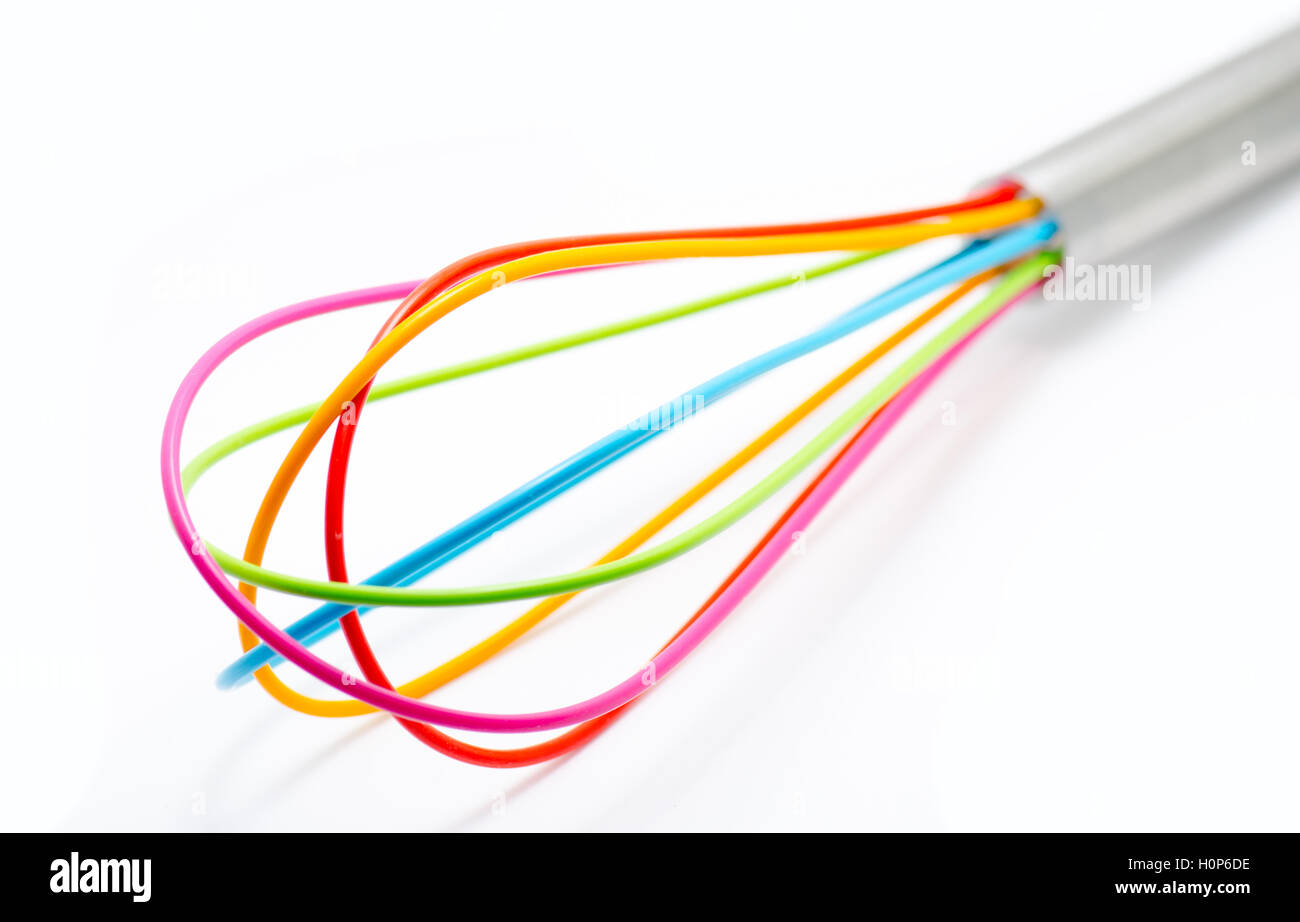 Colored plastic french whisk isolated on white Stock Photo - Alamy