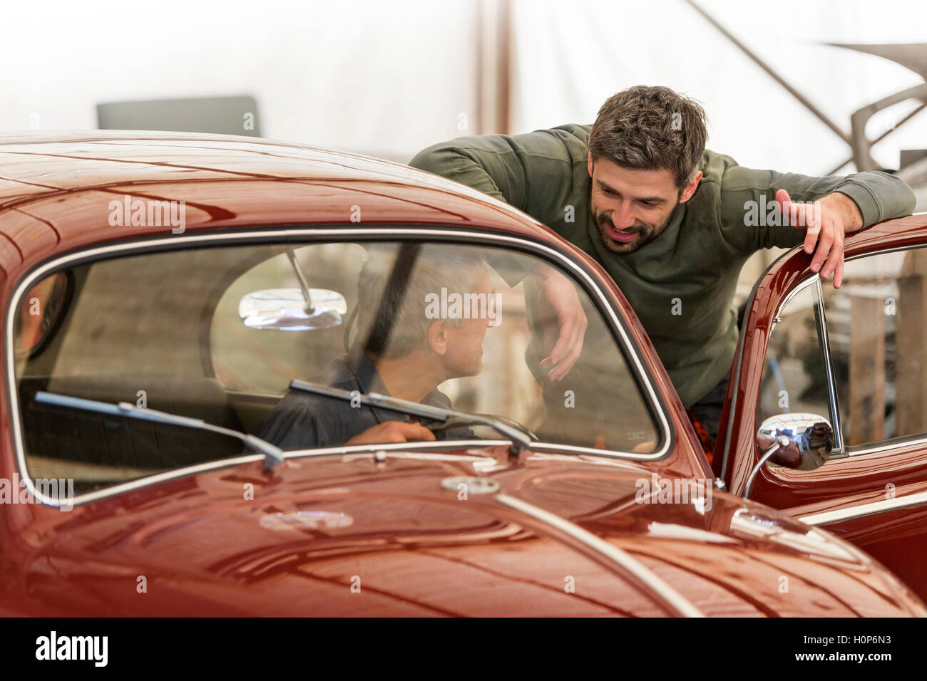 Auto mechanic talking car owner hi-res stock photography and images - Alamy