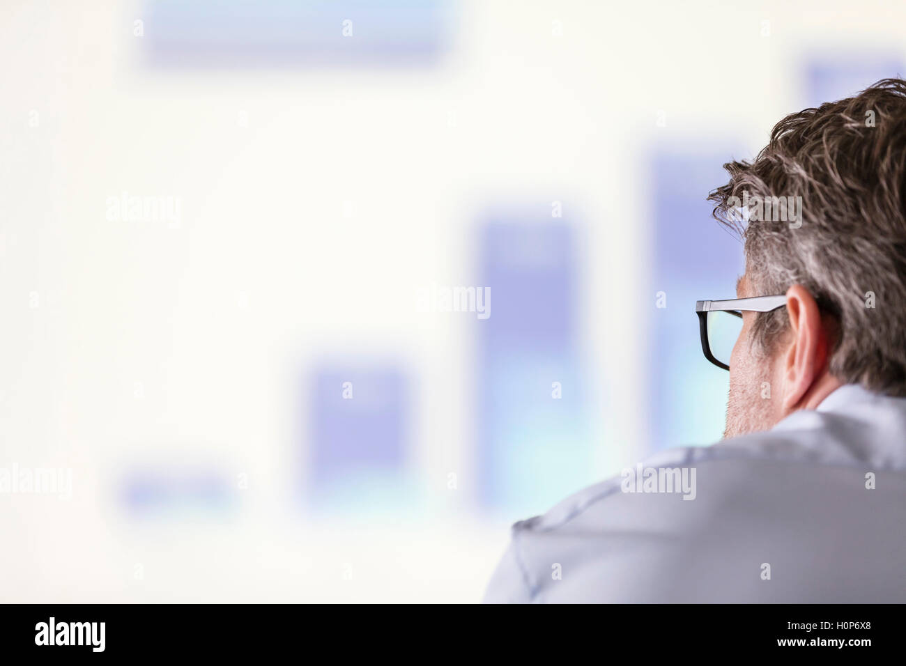 businessman looking bar chart projection screen Stock Photo - Alamy