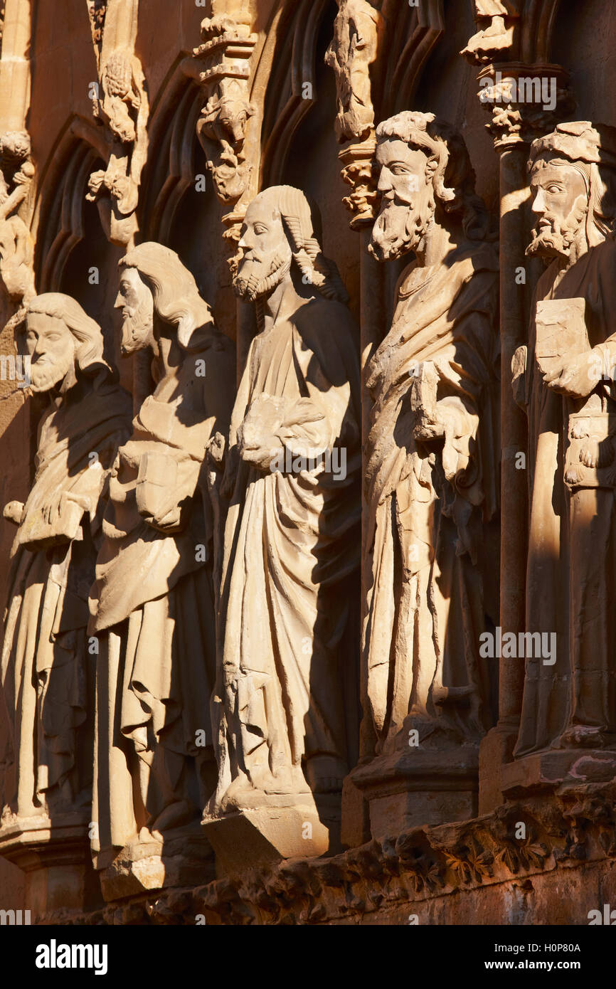 Ancient stone sculptures in a spanish cathedral portico. Olite, Navarra ...