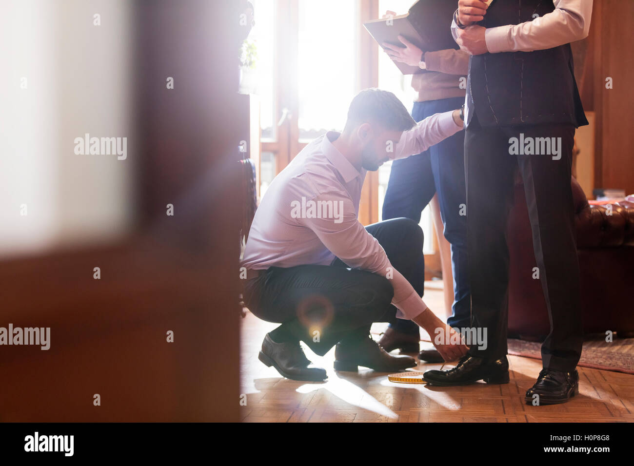 Tailor fitting hi-res stock photography and images - Alamy