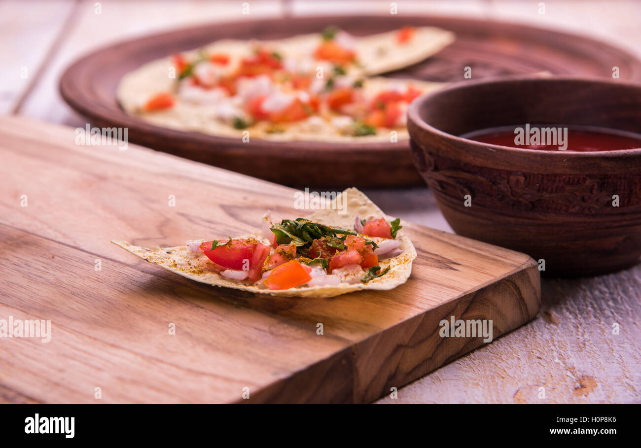 masala papad or roll papad indian vegetarian crispy food or starter ...