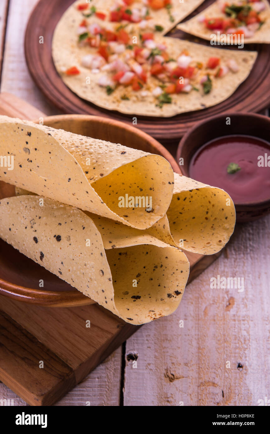 masala papad or roll papad indian vegetarian crispy food or starter ...