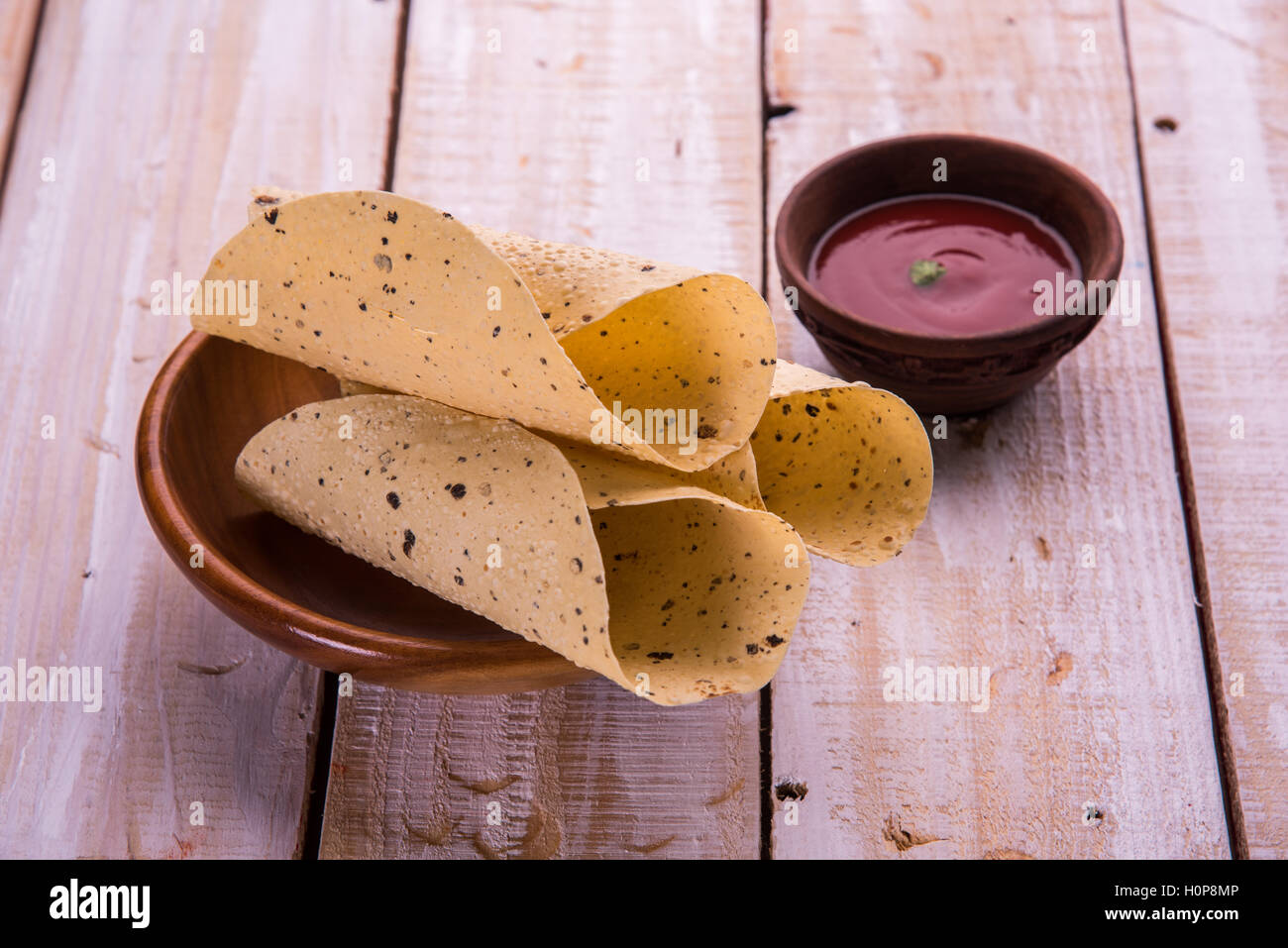 masala papad or roll papad indian vegetarian crispy food or starter ...