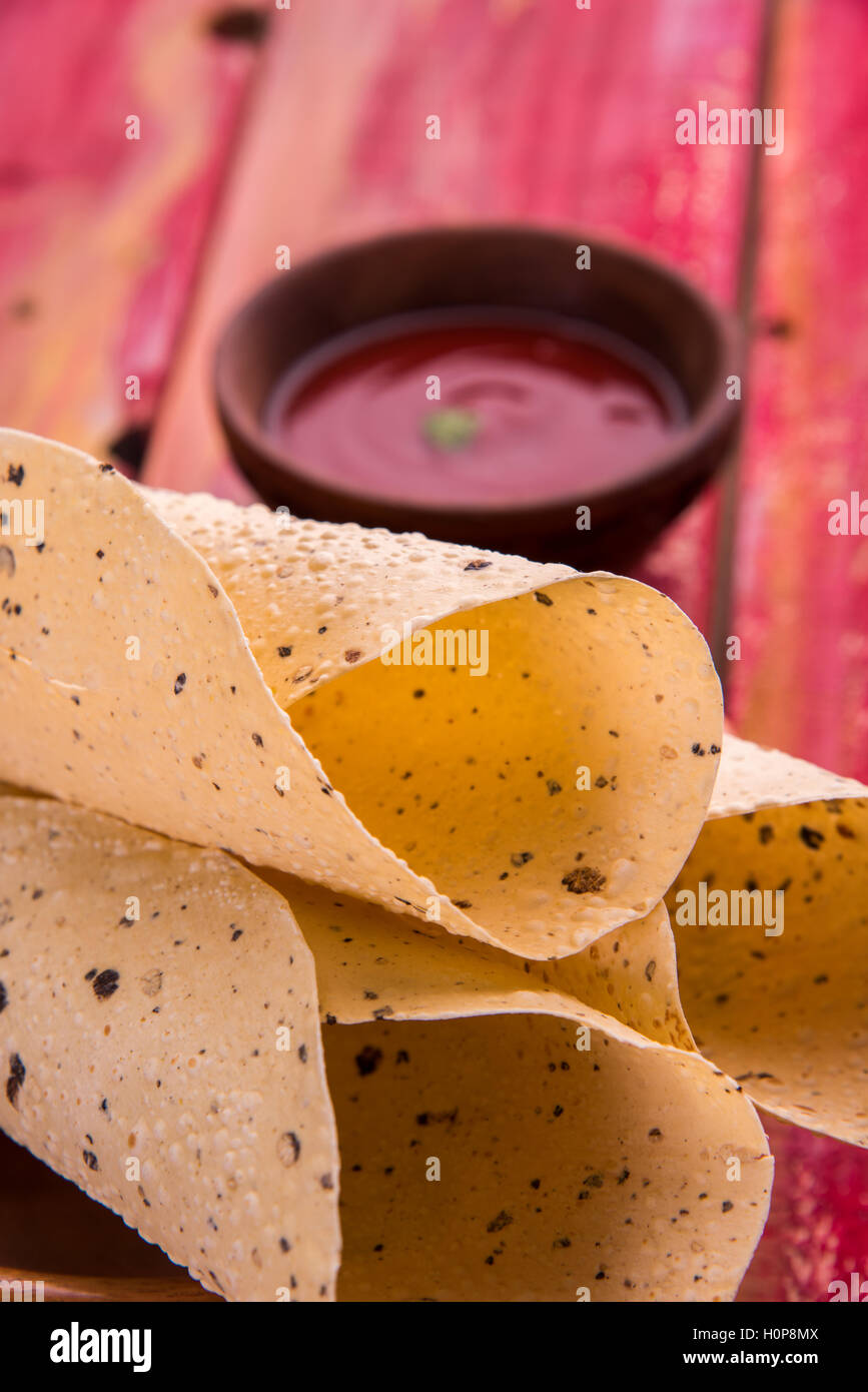 masala papad or roll papad indian vegetarian crispy food or starter ...