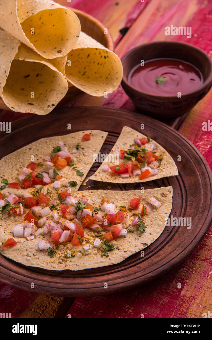 masala papad or roll papad indian vegetarian crispy food or starter ...