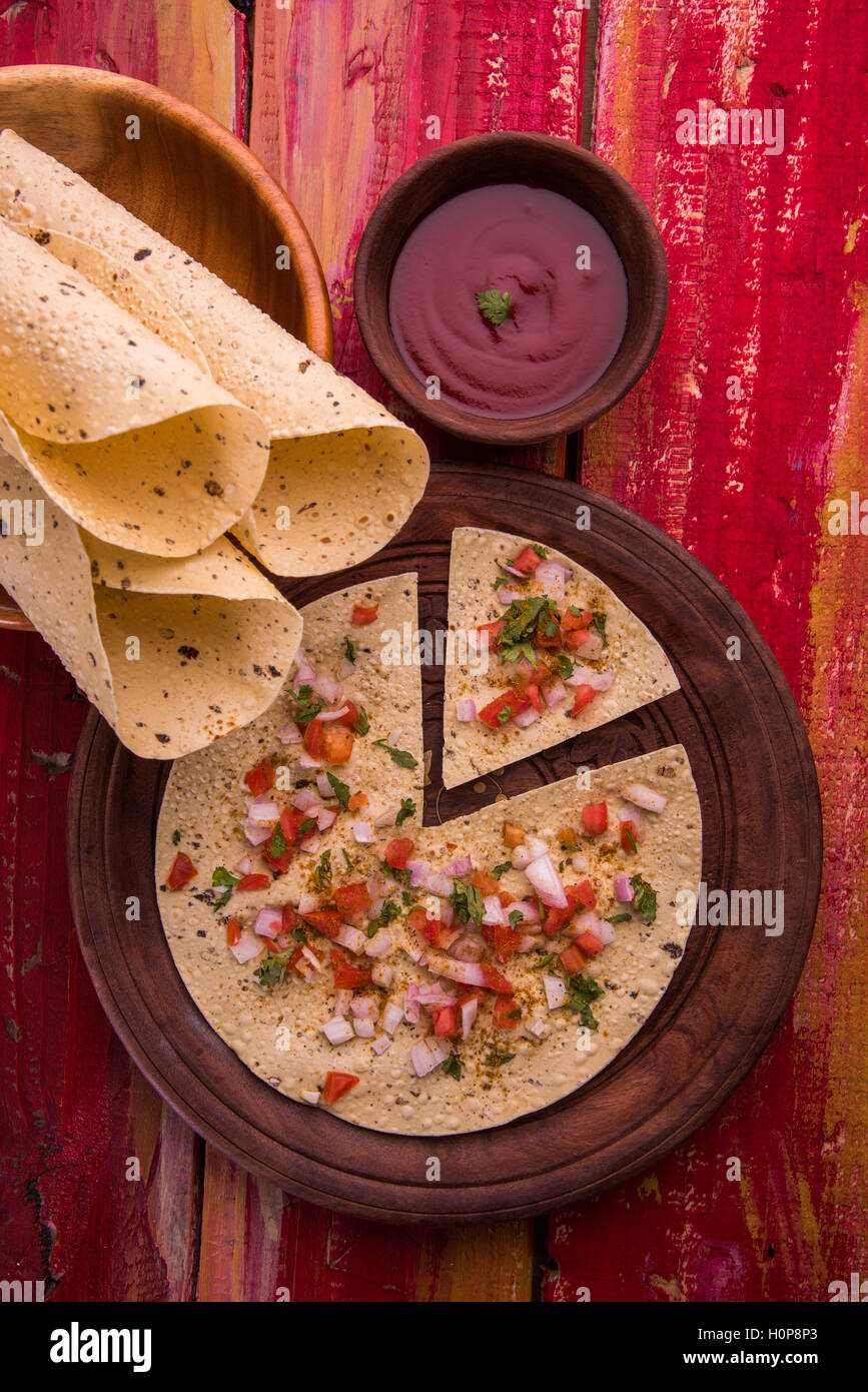 masala papad or roll papad indian vegetarian crispy food or starter ...