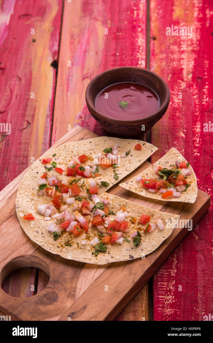 masala papad or roll papad indian vegetarian crispy food or starter ...