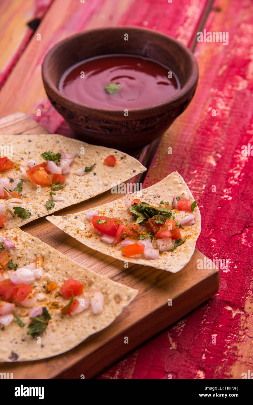 masala papad or roll papad indian vegetarian crispy food or starter ...