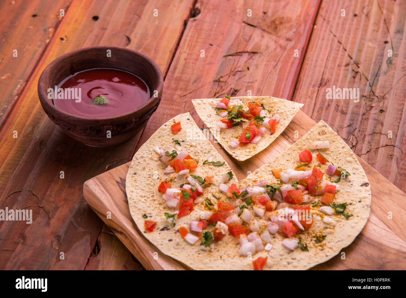 masala papad or roll papad indian vegetarian crispy food or starter ...