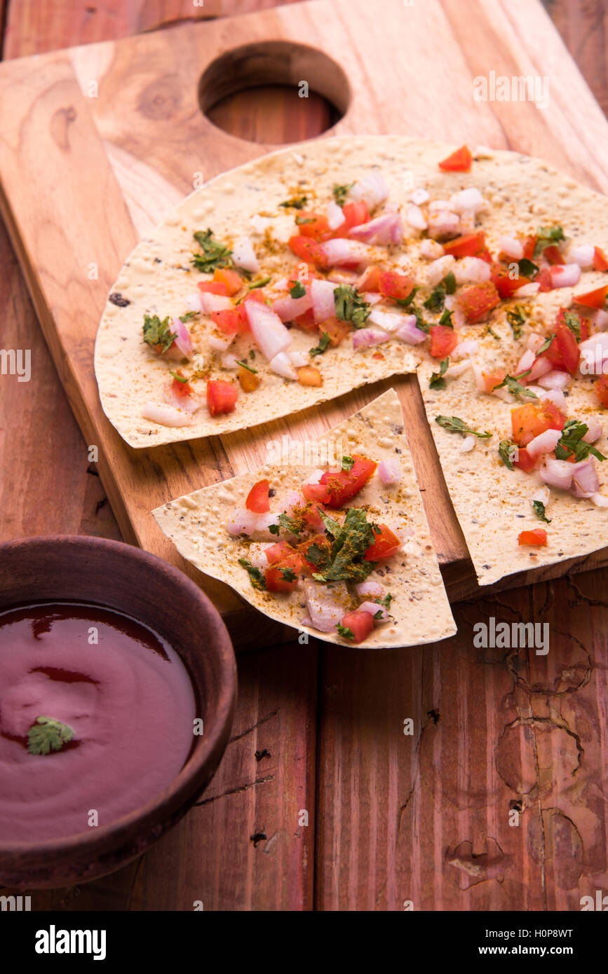 masala papad or roll papad indian vegetarian crispy food or starter ...