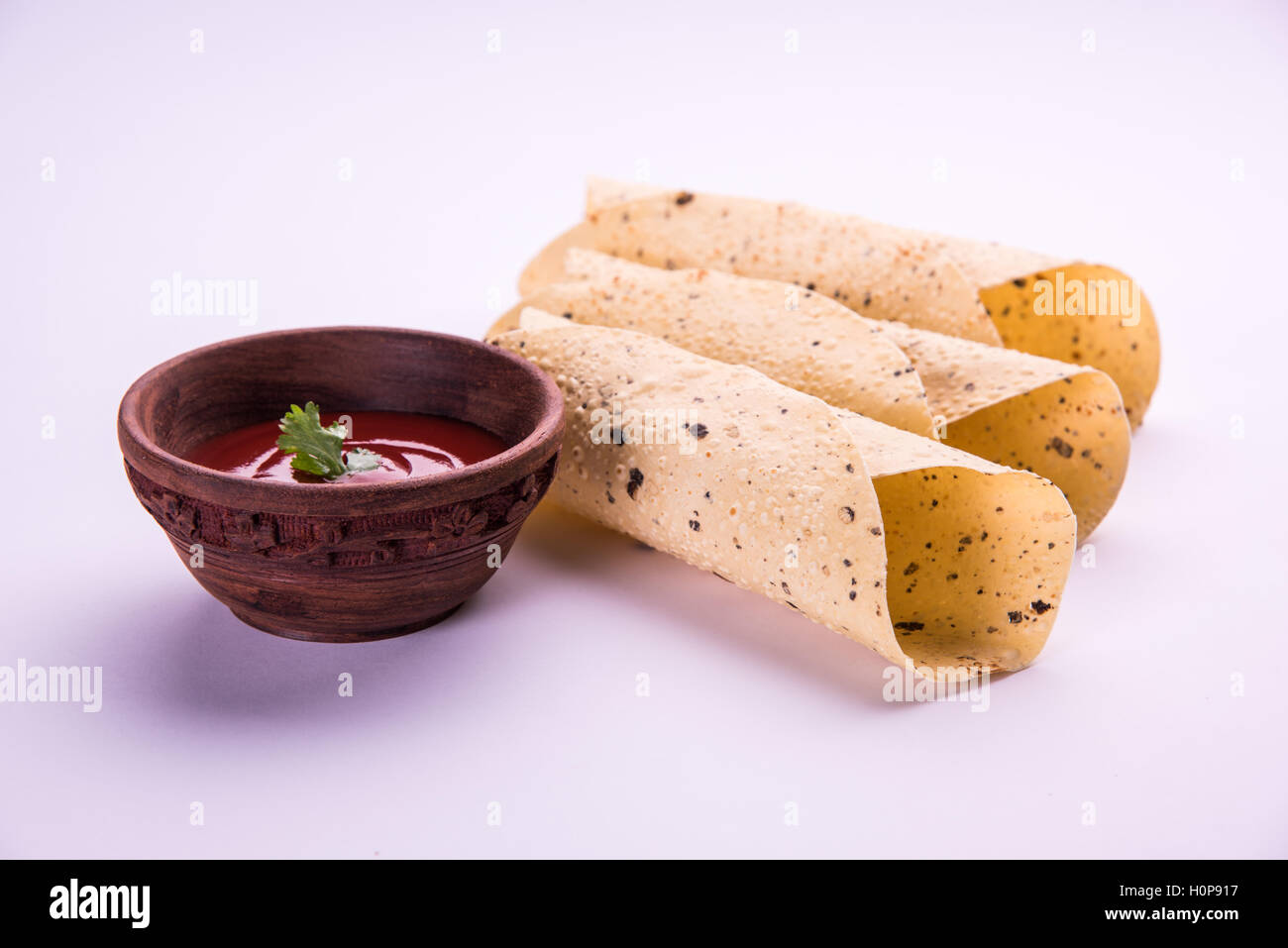 masala papad or roll papad indian vegetarian crispy food or starter ...