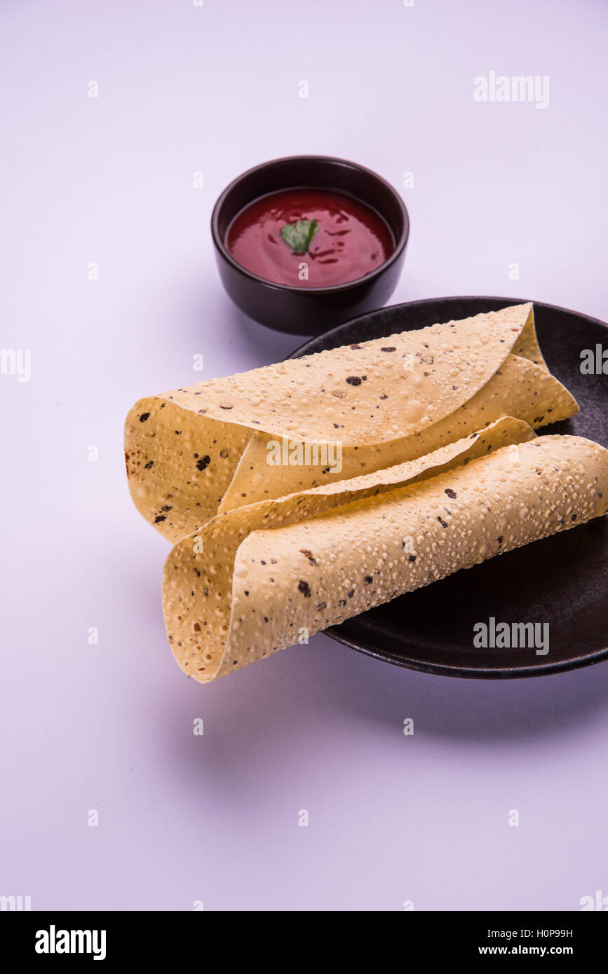 masala papad or roll papad indian vegetarian crispy food or starter ...