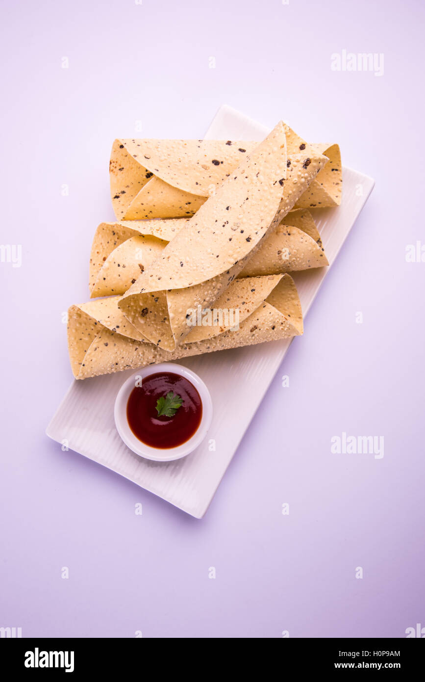 masala papad or roll papad indian vegetarian crispy food or starter ...
