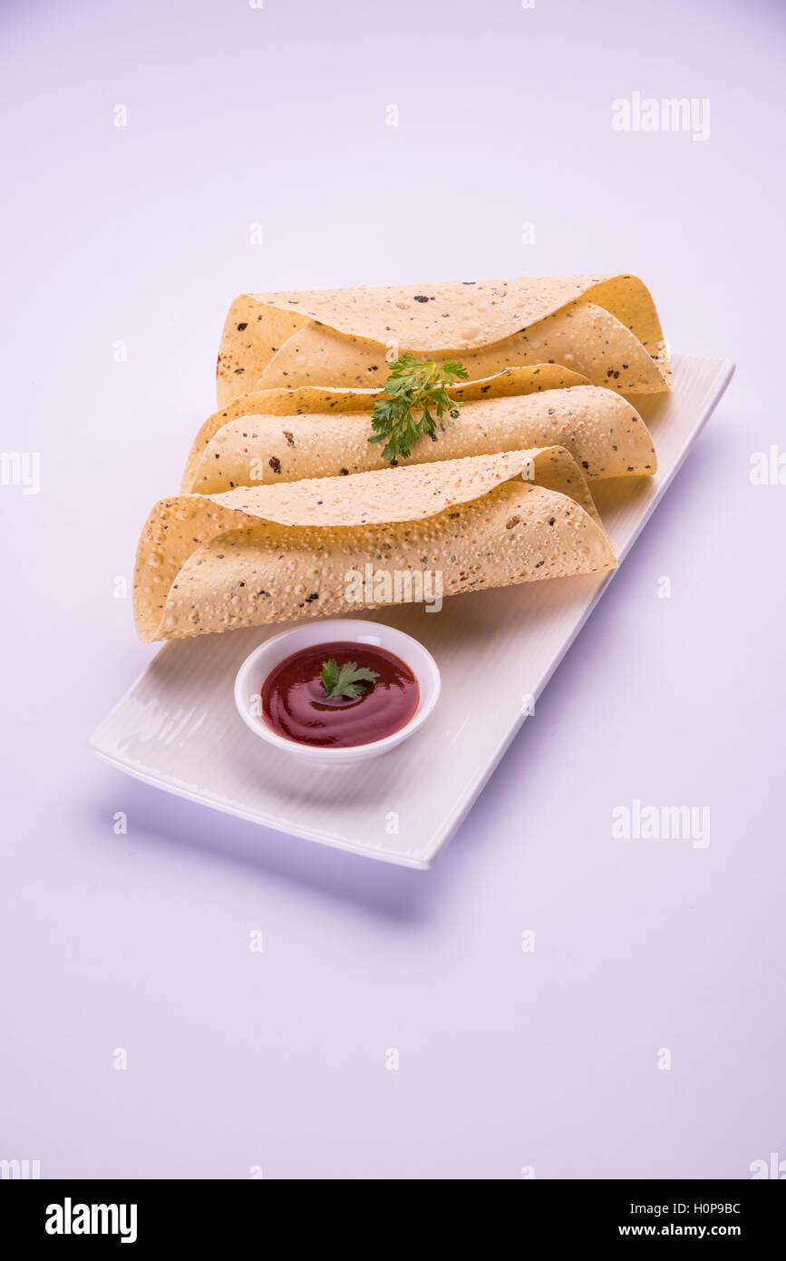 masala papad or roll papad indian vegetarian crispy food or starter ...