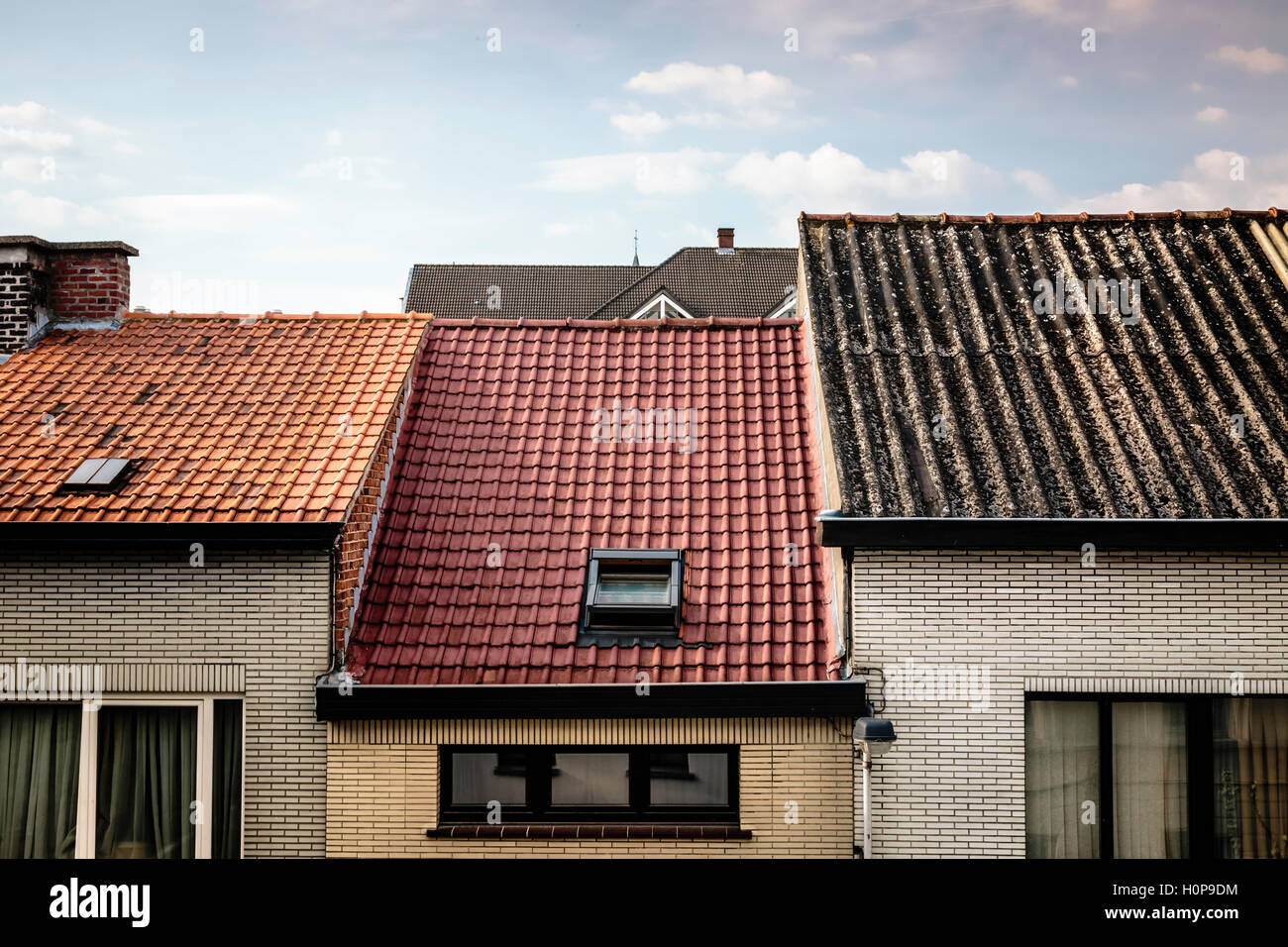 Roofs of apartment houses joined together in an urban housing ...