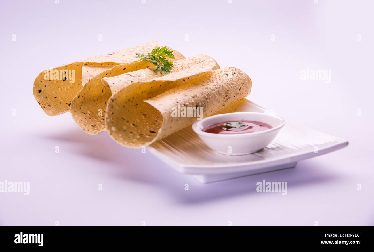 masala papad or roll papad indian vegetarian crispy food or starter ...