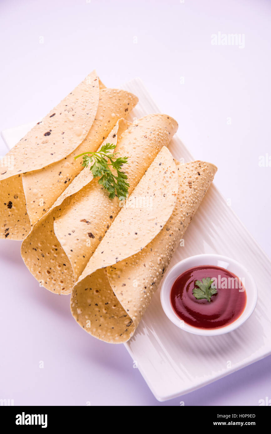 masala papad or roll papad indian vegetarian crispy food or starter ...