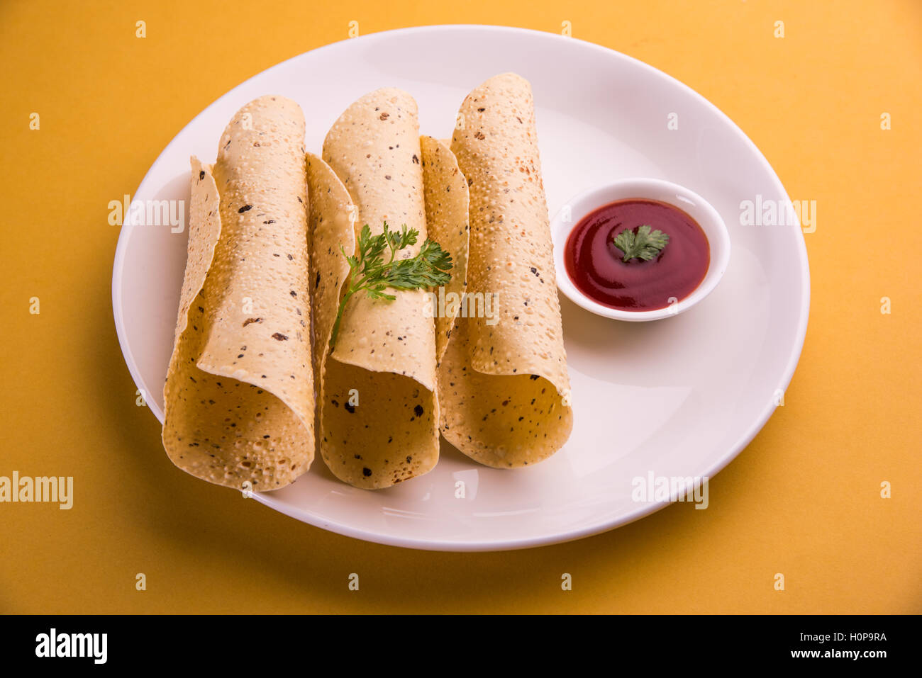 masala papad or roll papad indian vegetarian crispy food or starter ...