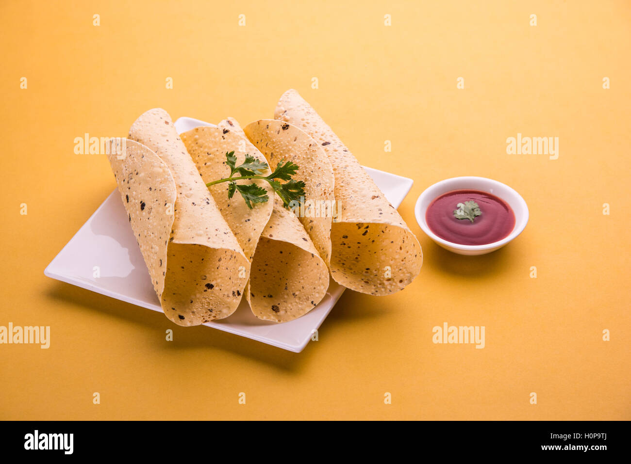 masala papad or roll papad indian vegetarian crispy food or starter ...