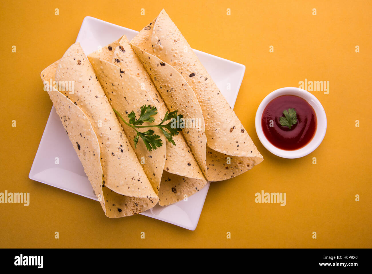 masala papad or roll papad indian vegetarian crispy food or starter ...