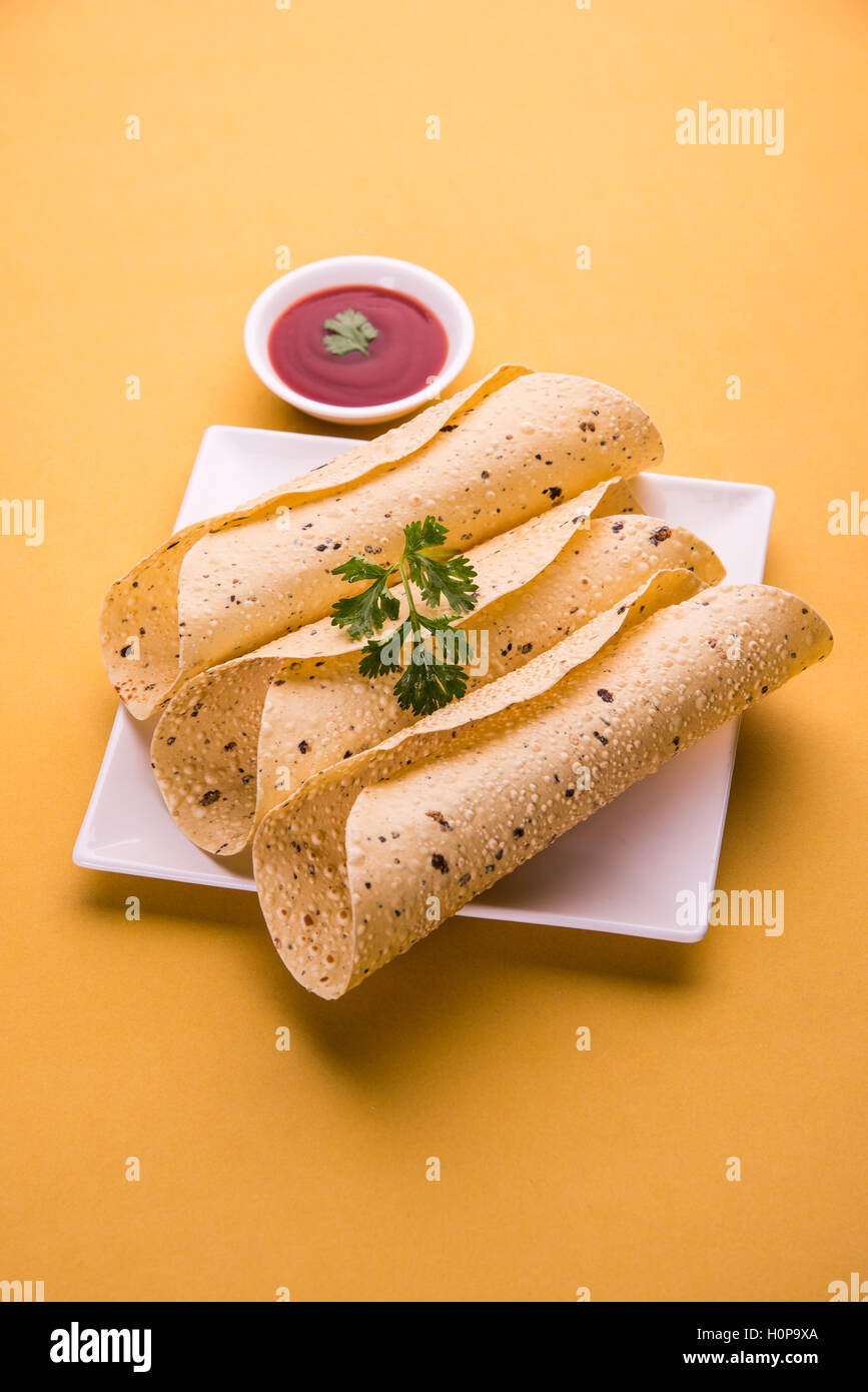 masala papad or roll papad indian vegetarian crispy food or starter ...