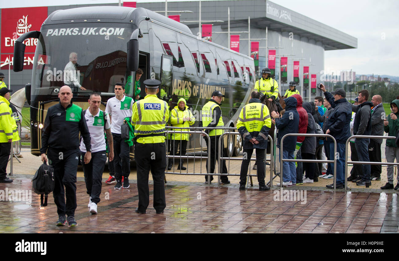 Celtic fans wait in the rain as the team bus arrives for the Betfred ...