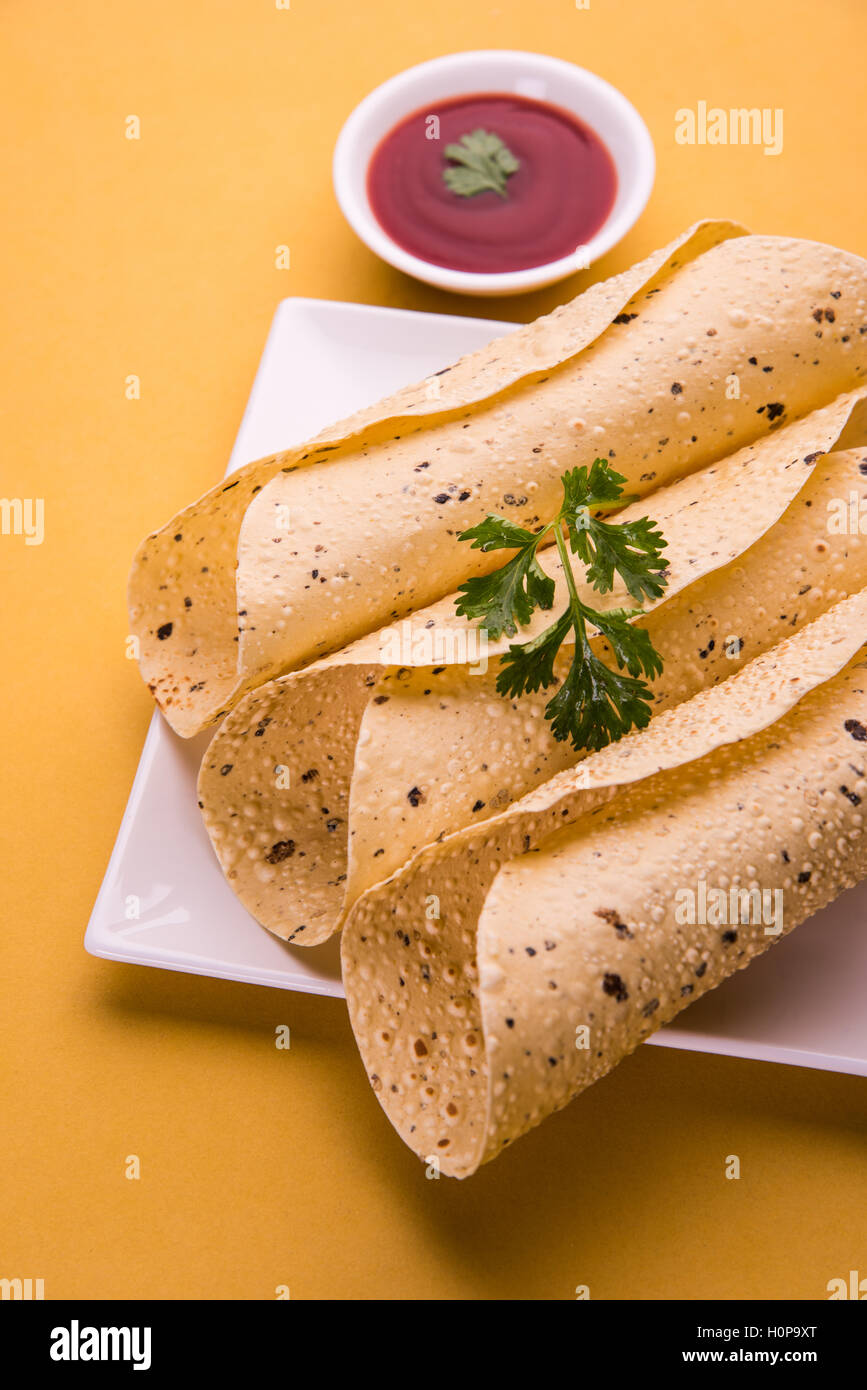 masala papad or roll papad indian vegetarian crispy food or starter ...