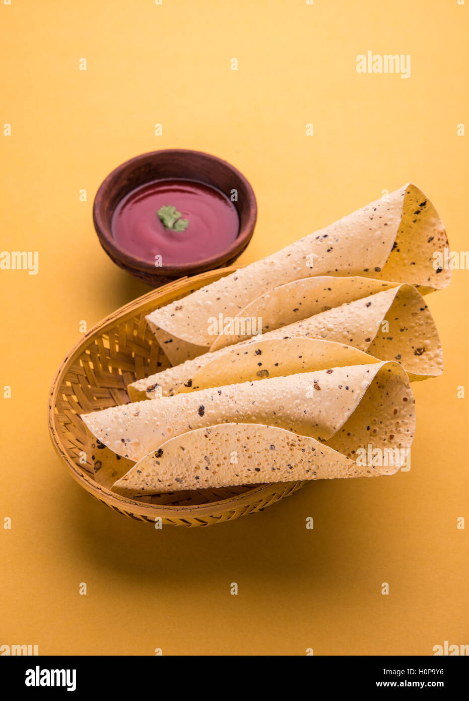 masala papad or roll papad indian vegetarian crispy food or starter ...