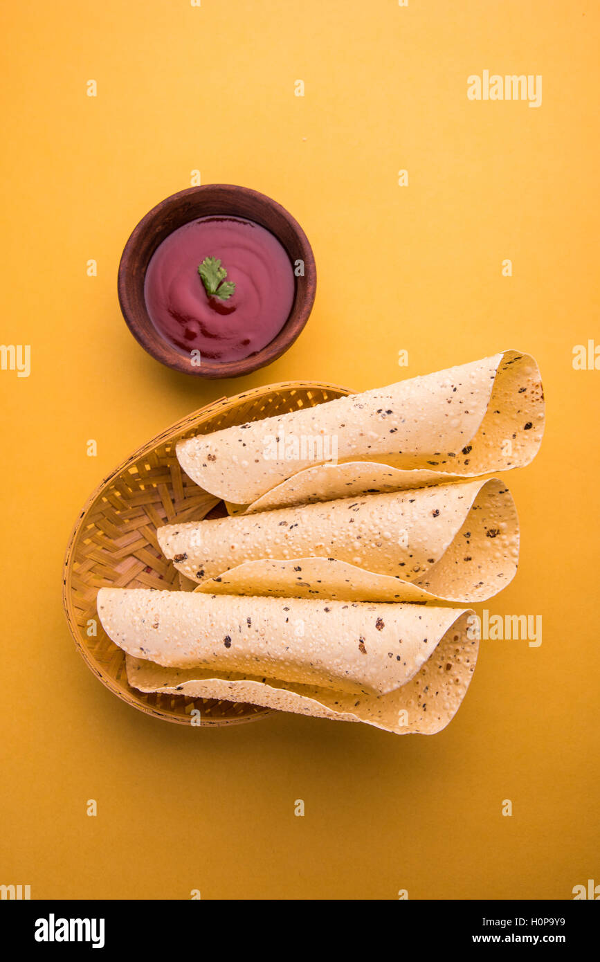 masala papad or roll papad indian vegetarian crispy food or starter ...