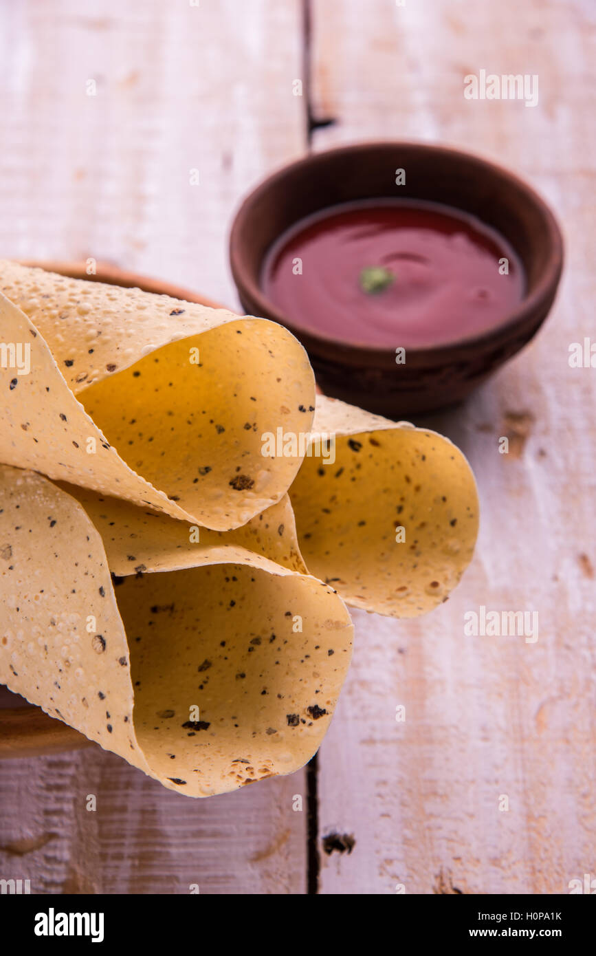 masala papad or roll papad indian vegetarian crispy food or starter ...