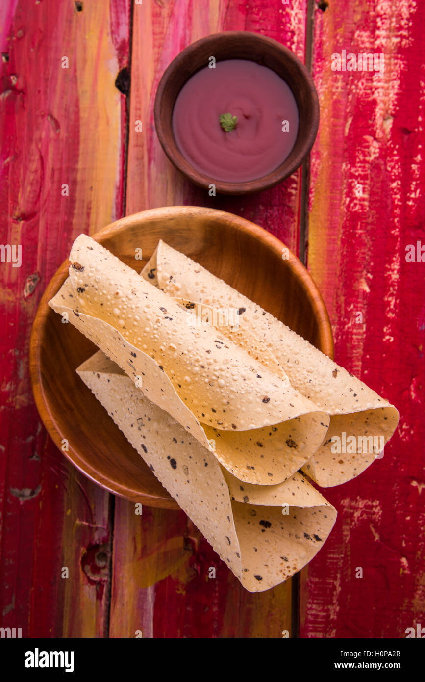 masala papad or roll papad indian vegetarian crispy food or starter ...