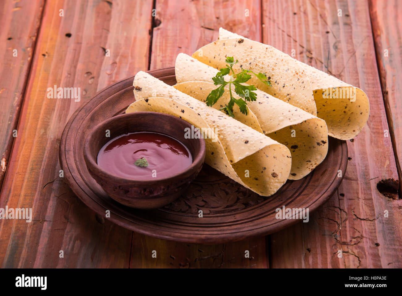 masala papad or roll papad indian vegetarian crispy food or starter ...