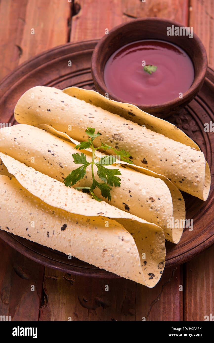 masala papad or roll papad indian vegetarian crispy food or starter ...