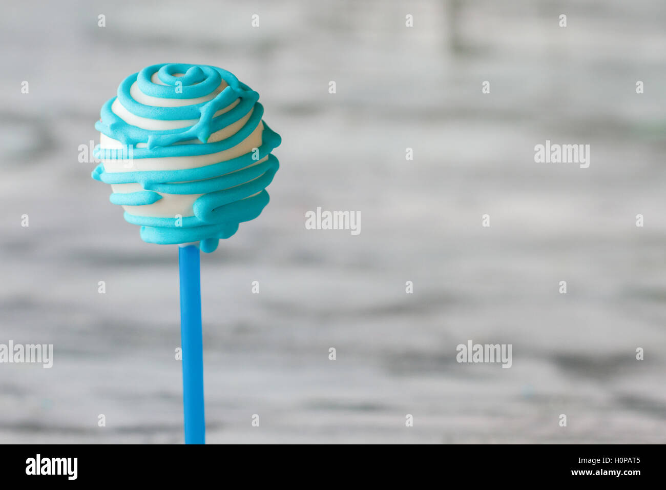 Candy on blurred gray background Stock Photo - Alamy