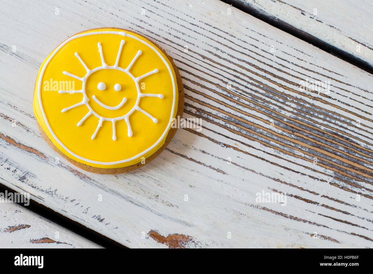 Cookie with smiling sun picture Stock Photo - Alamy