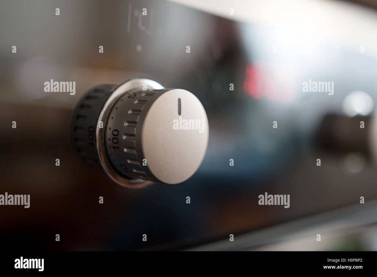 round knob metal power color Electric cookers Stock Photo - Alamy
