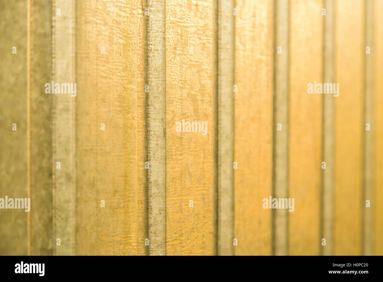 Corrugated yellow metal sheet wall Stock Photo - Alamy