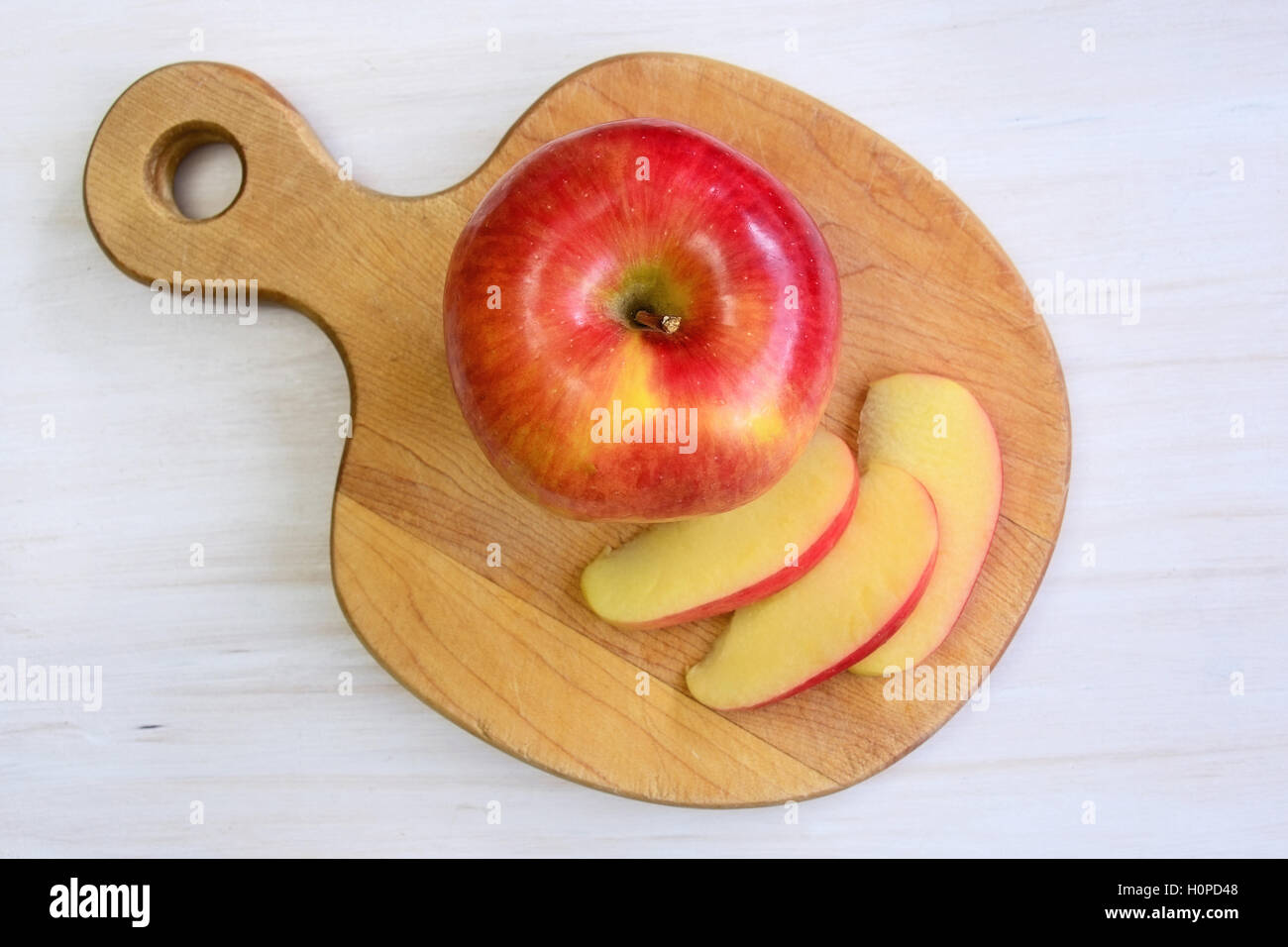 Beautiful honeycrisp apple on unique apple shaped cutting board on ...