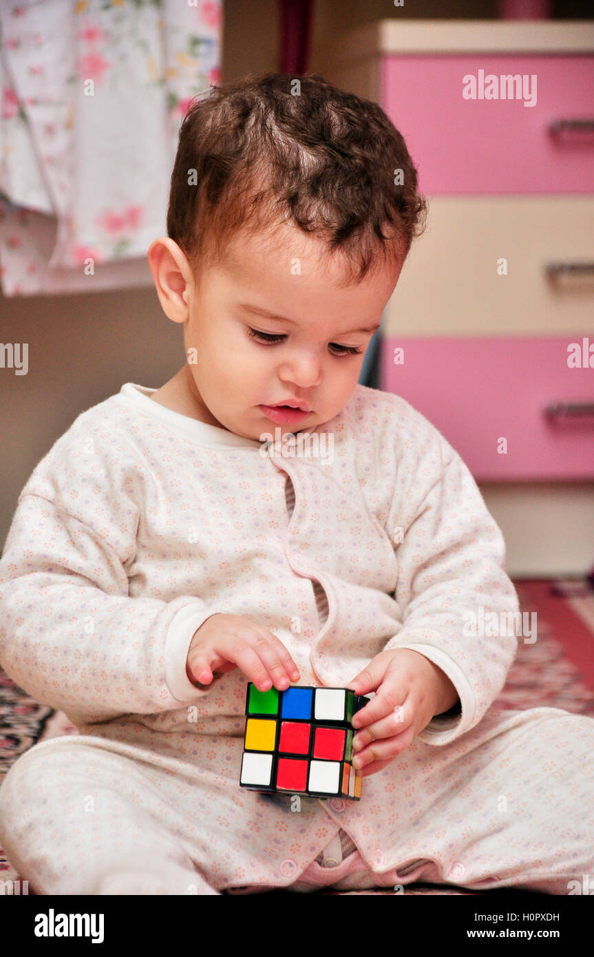 A Little Boy Playing with His Cube Toy Stock Photo - Alamy