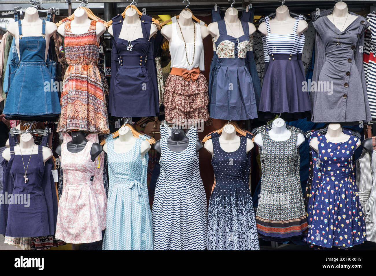 A selection of dresses on sale on a market stall on dummies Stock Photo ...