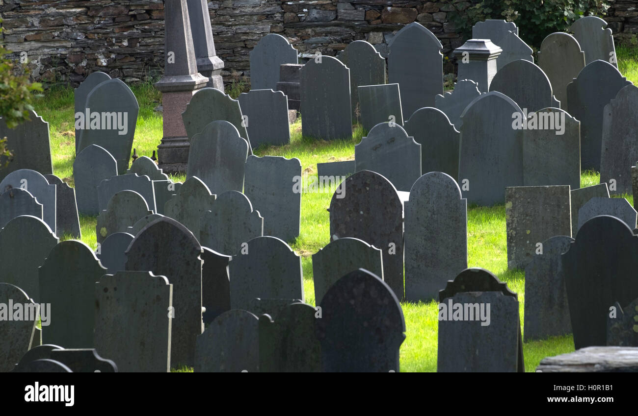 Grey gravestones backlight in graveyard Stock Photo - Alamy