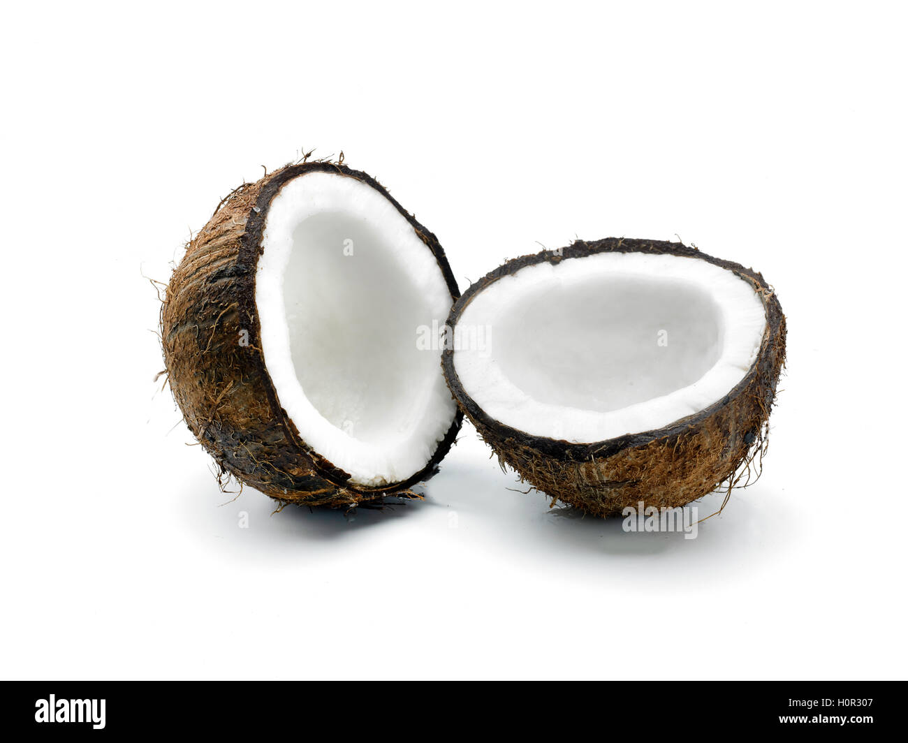 A single split coconut on a white background Stock Photo - Alamy