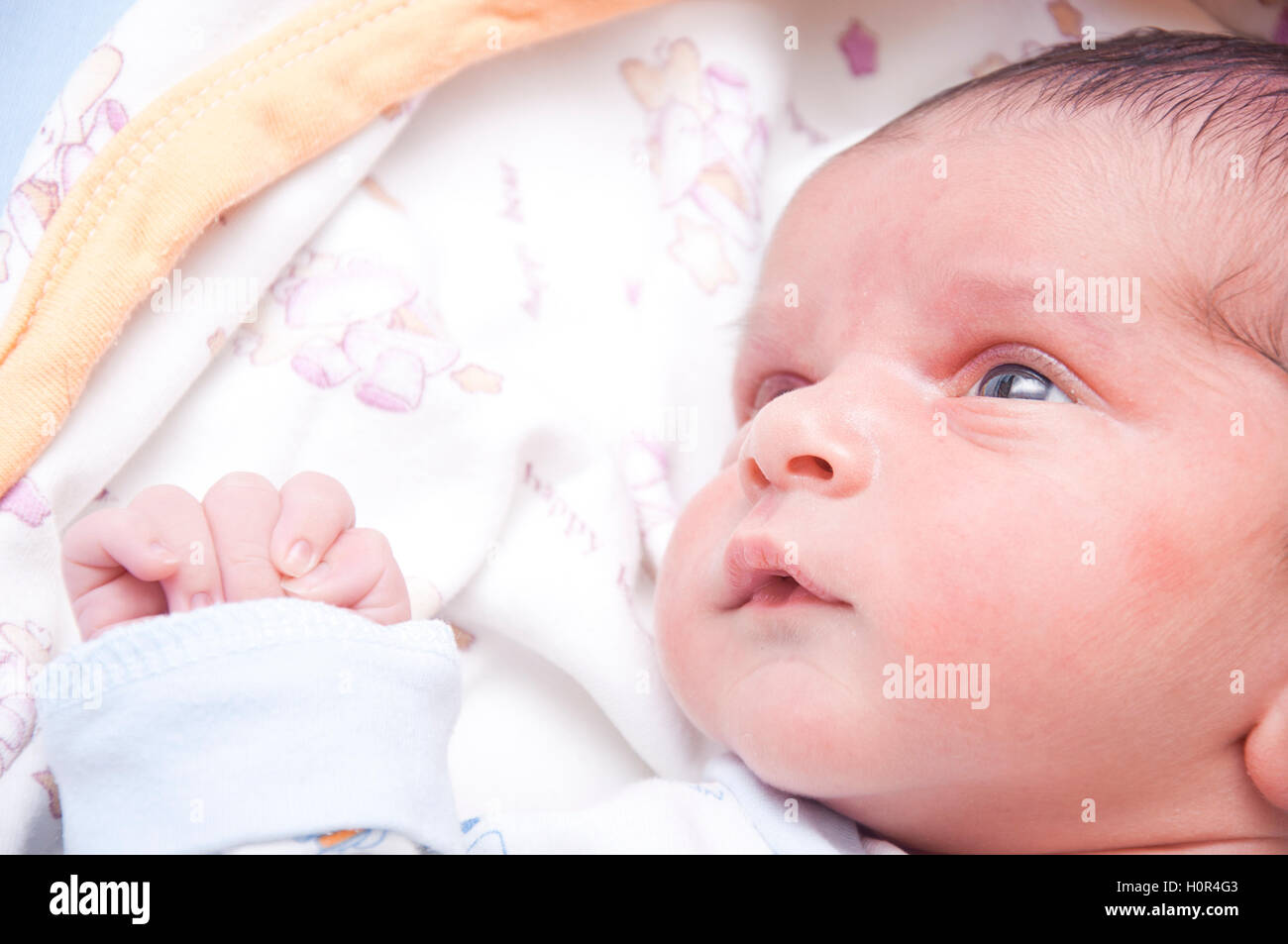 Baby Looking Up with Eye Contact with Mom Stock Photo - Alamy