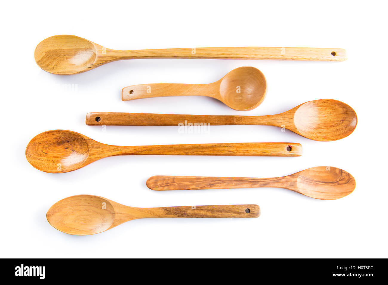 Wooden spoons set of different sizes isolated on a white background ...