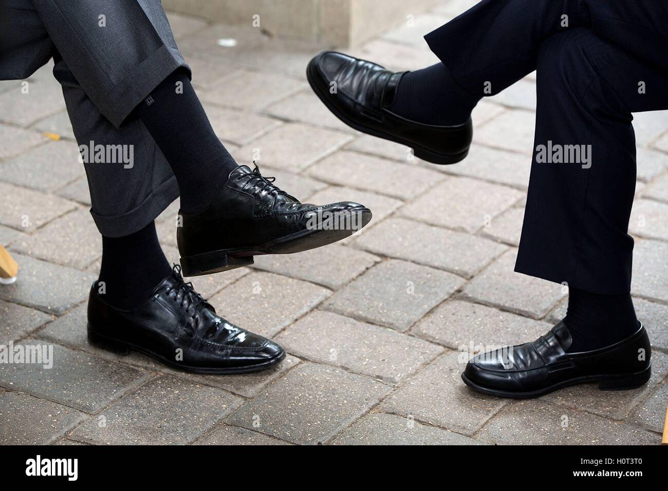 U.S. President Barack Obama (left) crosses his leg during an interview ...