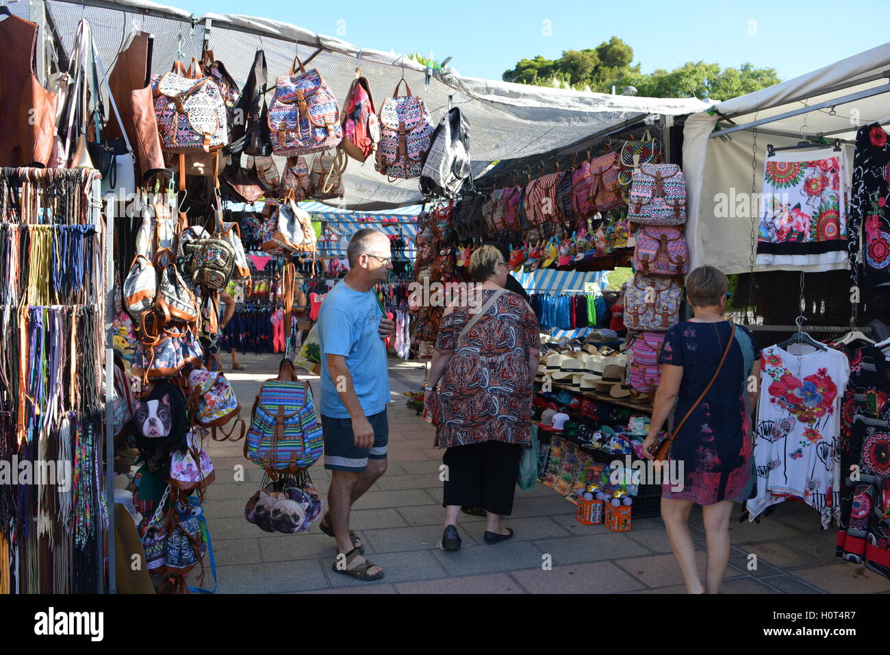 The outdoor Thursday Market in the summer. Stalls selling copy designer ...