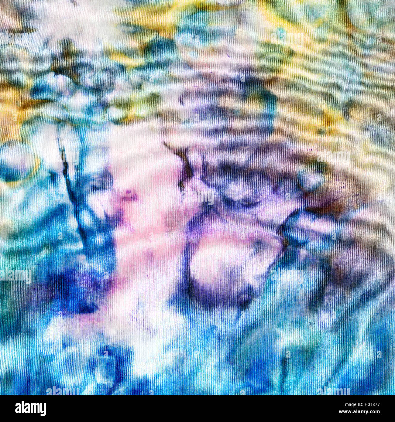 textile background - abstract blue and yellow pattern on colored silk ...