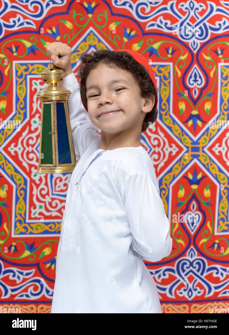 Happy Young Arabian Boy with Lantern Celebrating Ramadan Stock Photo ...