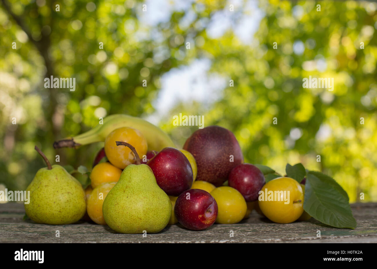 fruits in wooden table, outdoor Stock Photo - Alamy